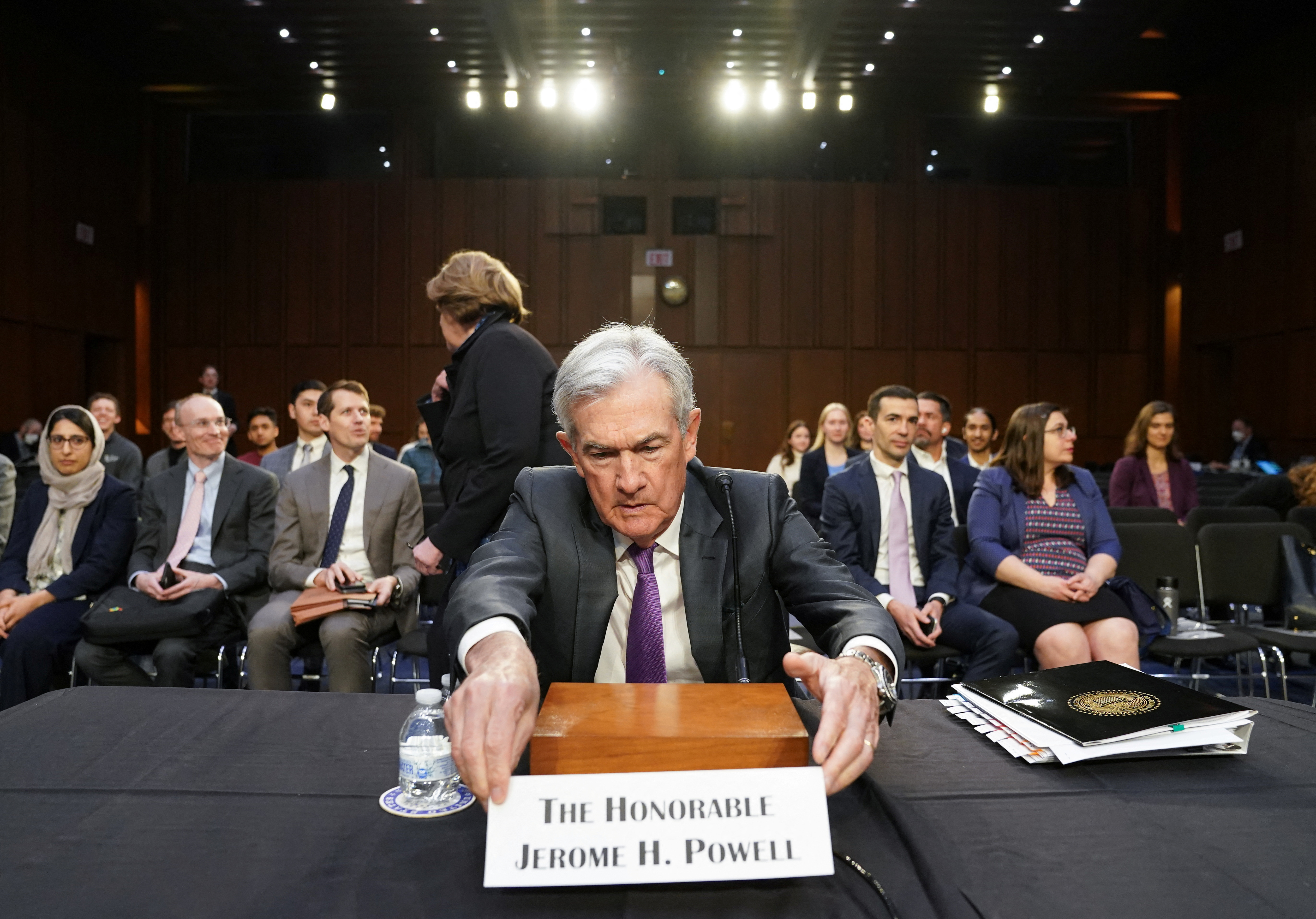 PRECIOUS-Gold range-bound as markets position for Powell's testimony